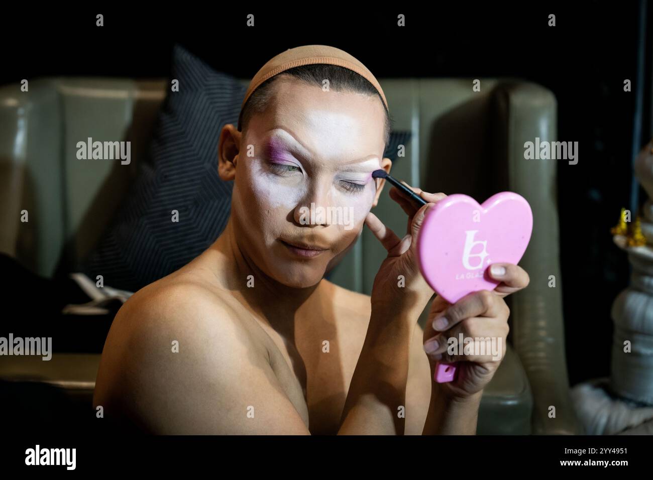 Thailand. 19th Dec, 2024. Kara Might does their makeup backstage before ...