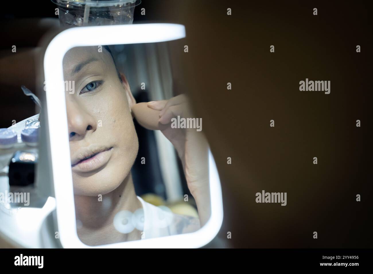 Thailand. 19th Dec, 2024. Zepee does their makeup backstage before the ...