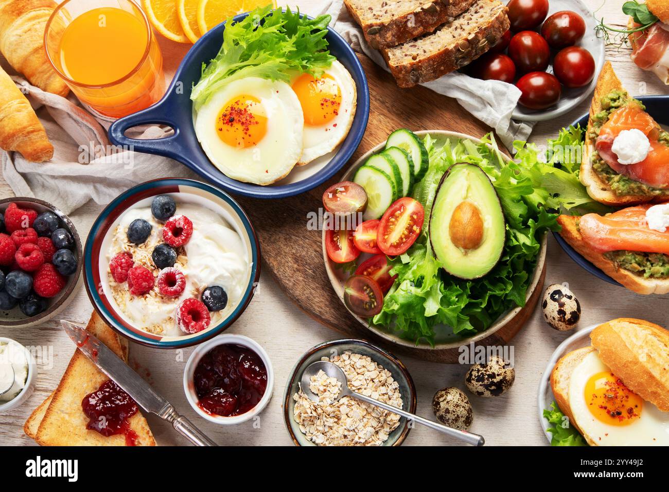 Breakfast food table. Huge healthy breakfast spread on a table with ...
