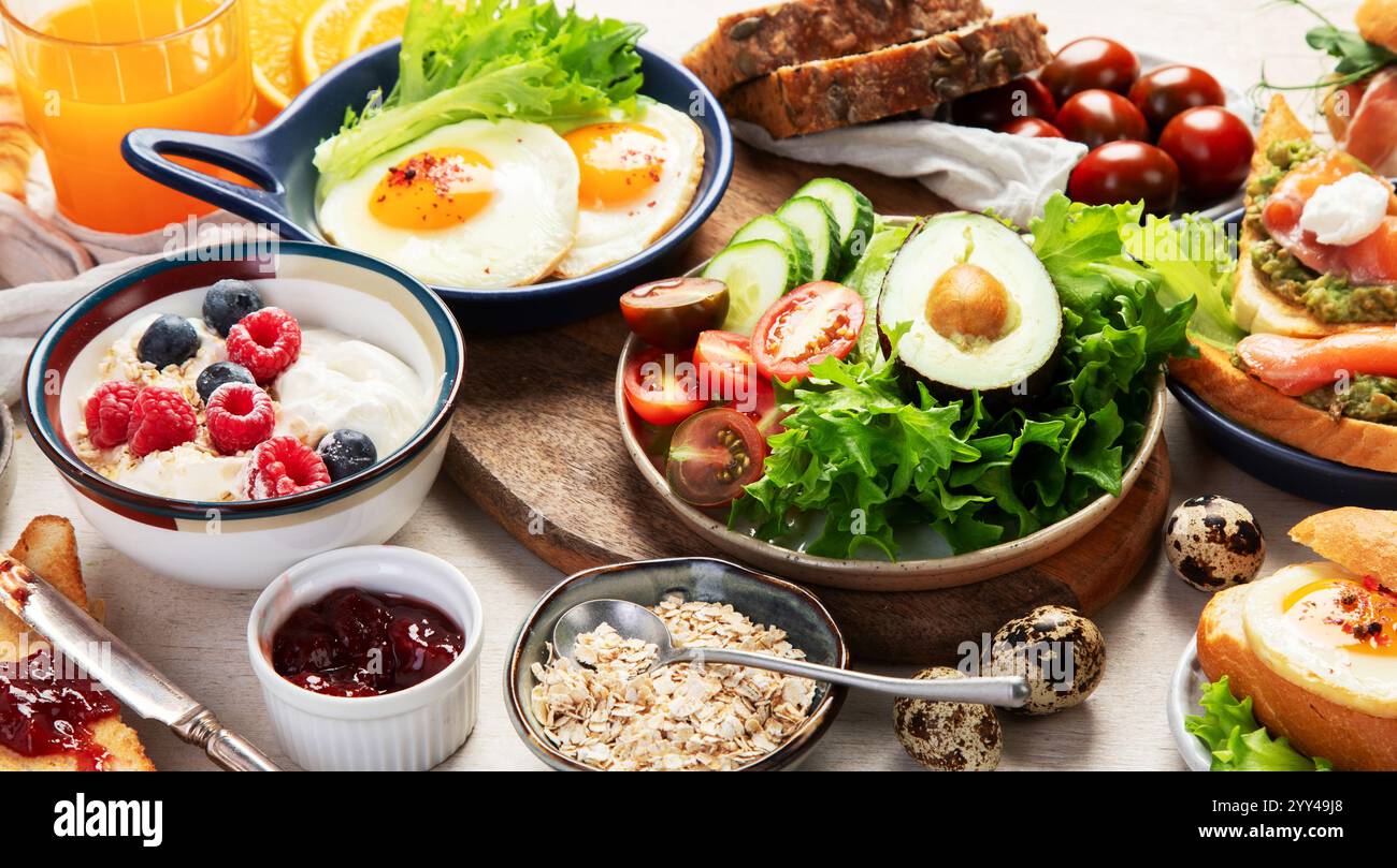 Breakfast food table. Huge healthy breakfast spread on a table with ...