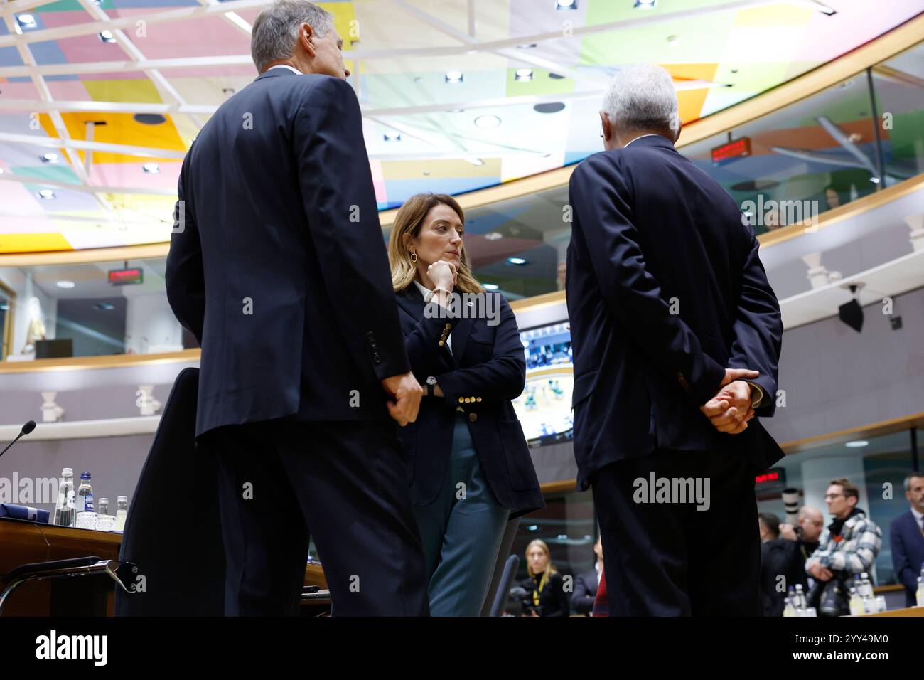 European Parliament President Roberta Metsola, center, speaks with ...