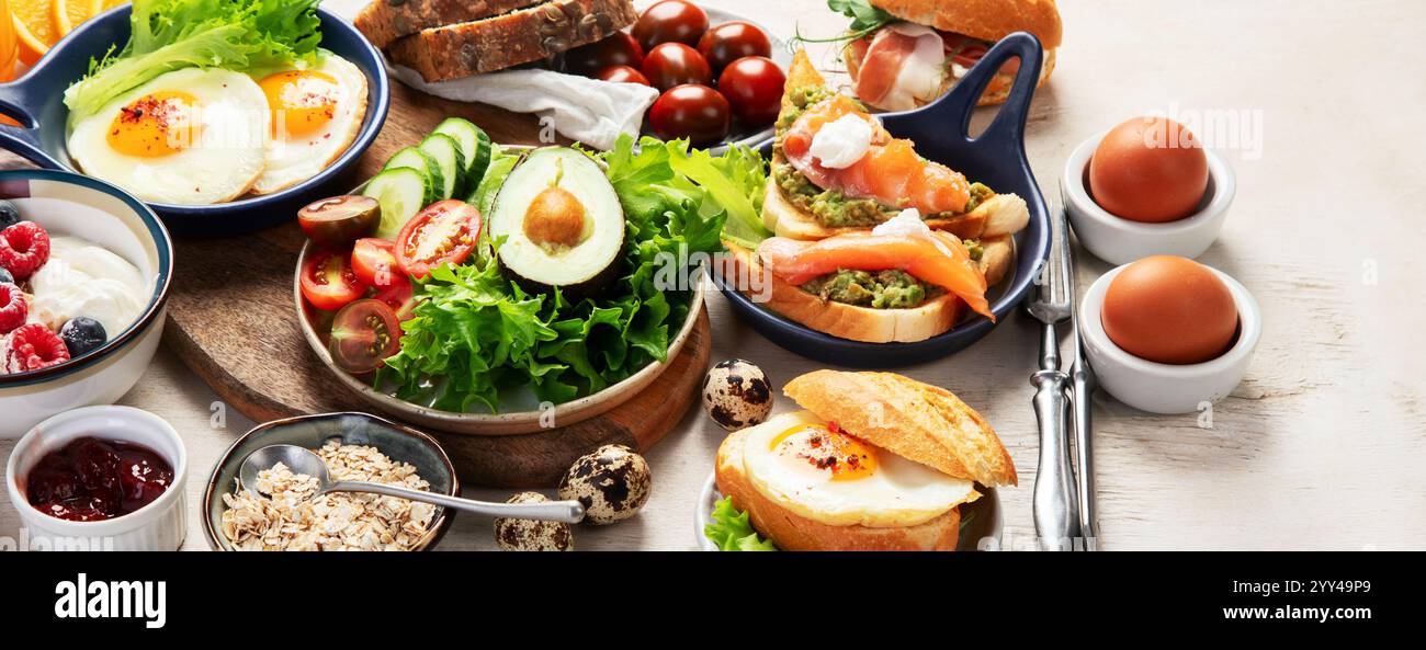 Breakfast food table. Huge healthy breakfast spread on a table with ...
