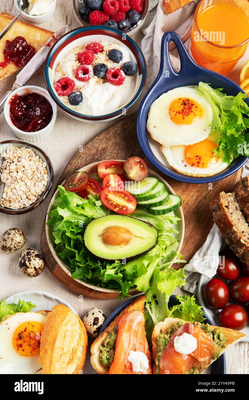 Breakfast food table. Huge healthy breakfast spread on a table with ...