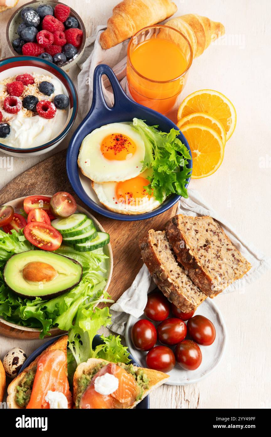 Breakfast food table. Huge healthy breakfast spread on a table with ...