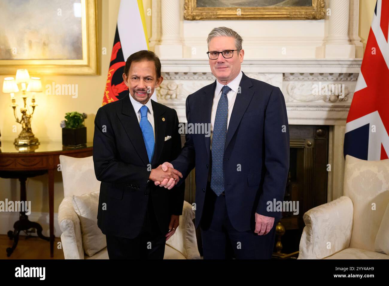 Britain's Prime Minister Keir Starmer, right, shakes hands with the ...