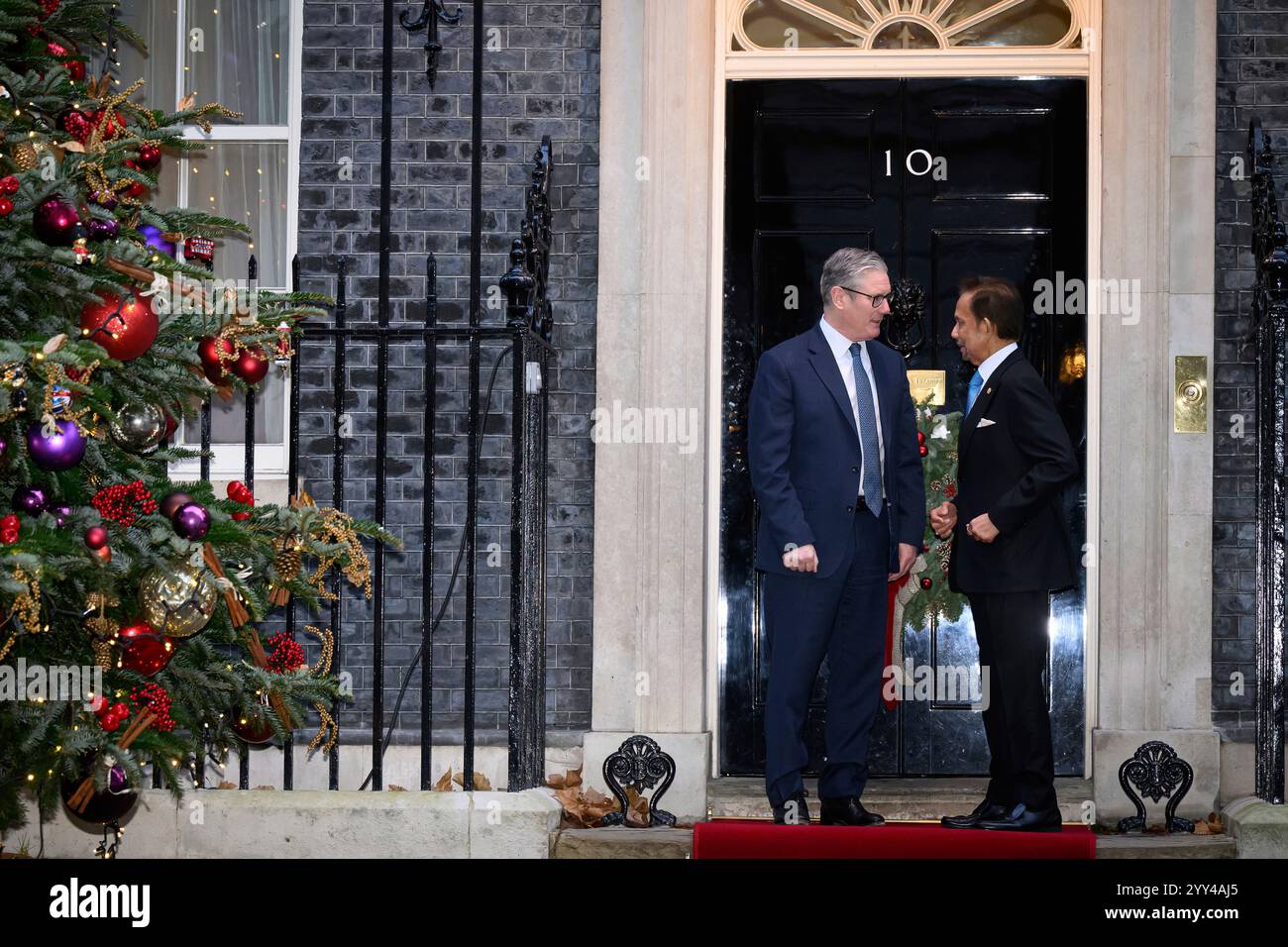 Britain's Prime Minister Keir Starmer, left, greets the Sultan of ...