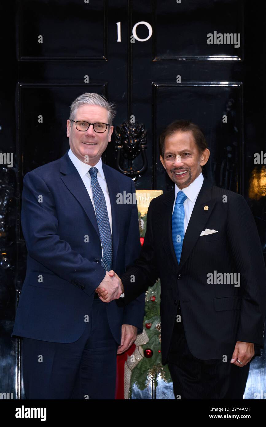 Britain's Prime Minister Keir Starmer, left, shakes hands with the ...