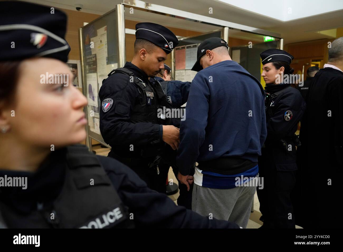 A defendant arrives in the Avignon courthouse, southern France ...