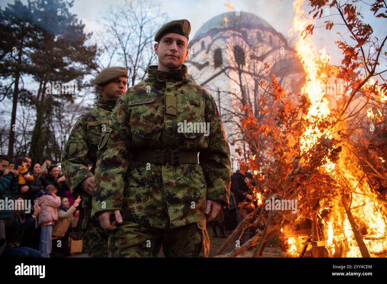 People watch a ceremonial burning of dried oak branches - the Yule log ...