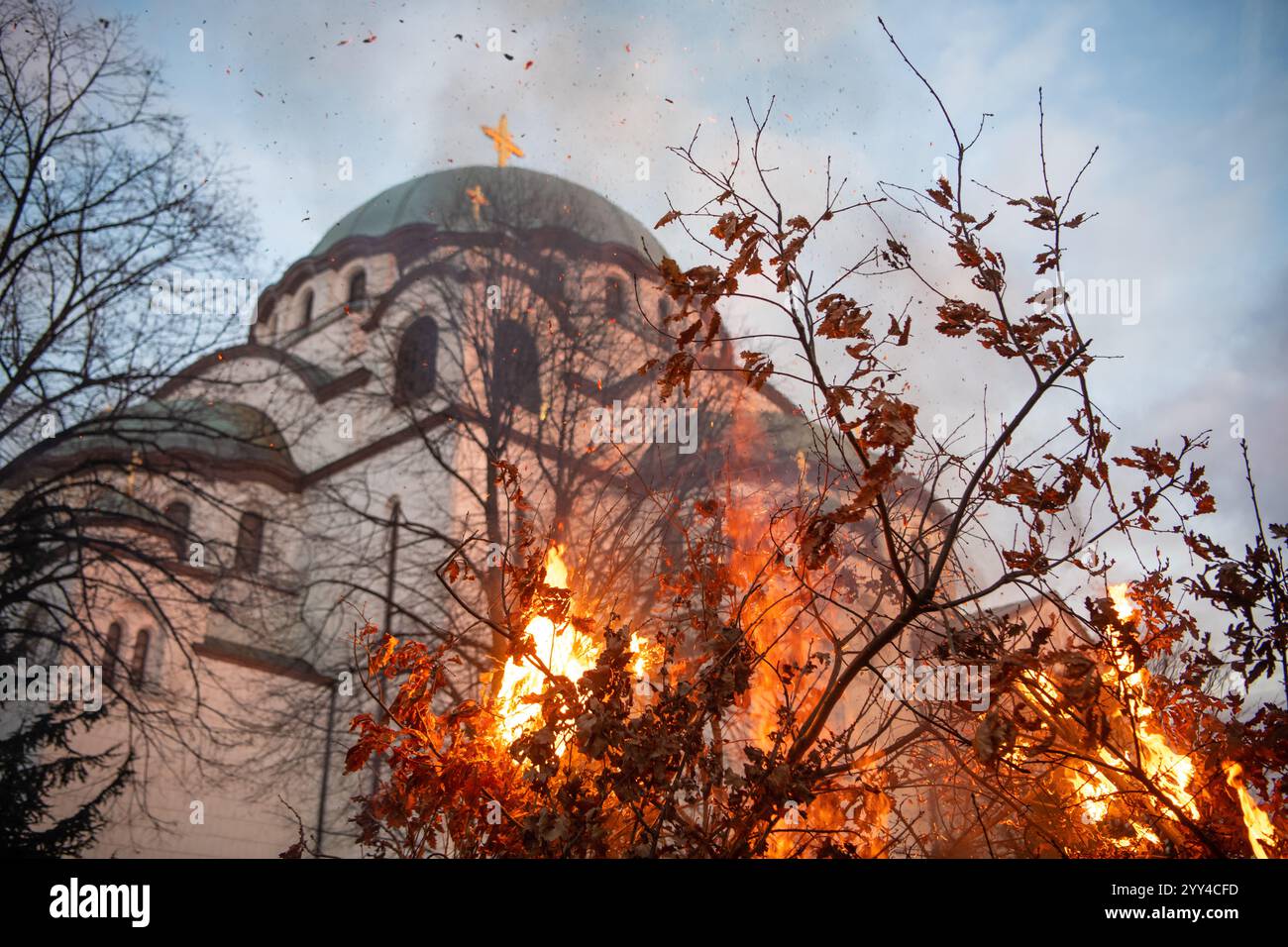 People watch a ceremonial burning of dried oak branches - the Yule log ...