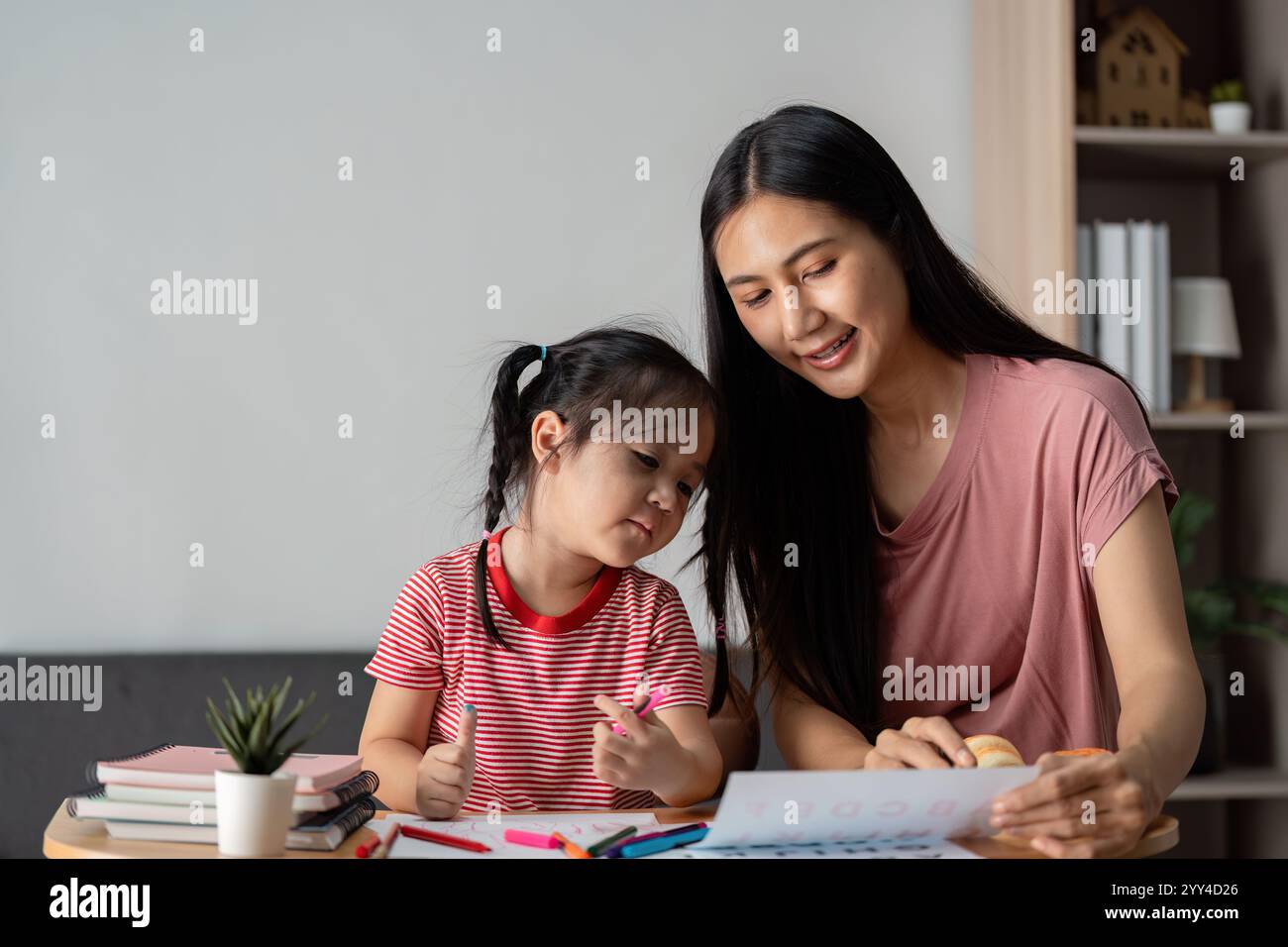 Parent and Child Engaged in Learning Activity at Home, Fostering ...