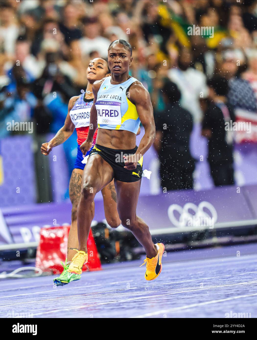 Julien Alfred winning in the 100 meters relay at the Paris 2024 Olympic ...