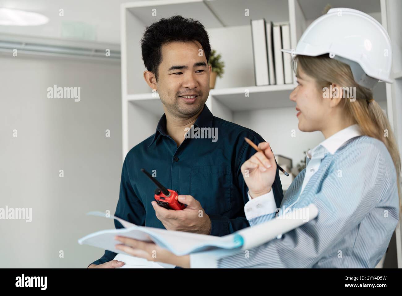 Professional Engineers Discussing Architectural Plans in Modern Office ...