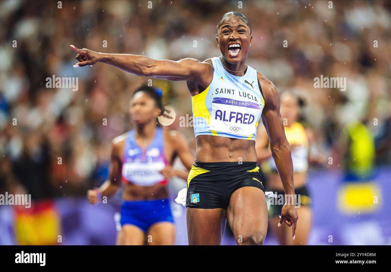 Julien Alfred winning in the 100 meters relay at the Paris 2024 Olympic ...