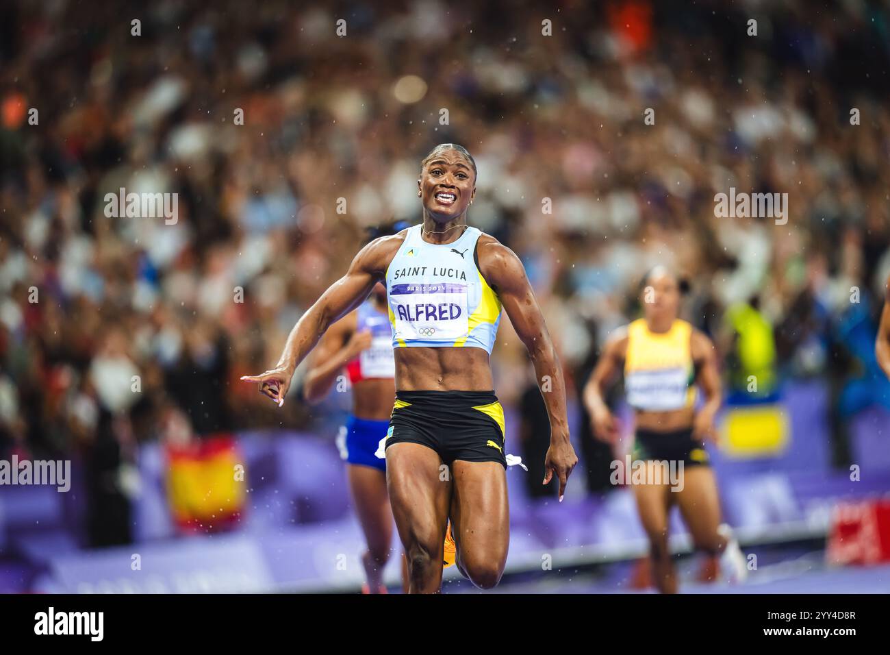 Julien Alfred winning in the 100 meters relay at the Paris 2024 Olympic ...