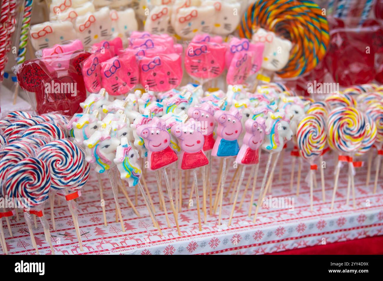 Assorted lollipops candies and jellies on street market. A lot of ...