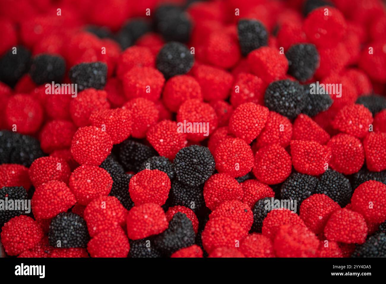 Assorted gummy candies and jellies on street market shop. A lot of ...