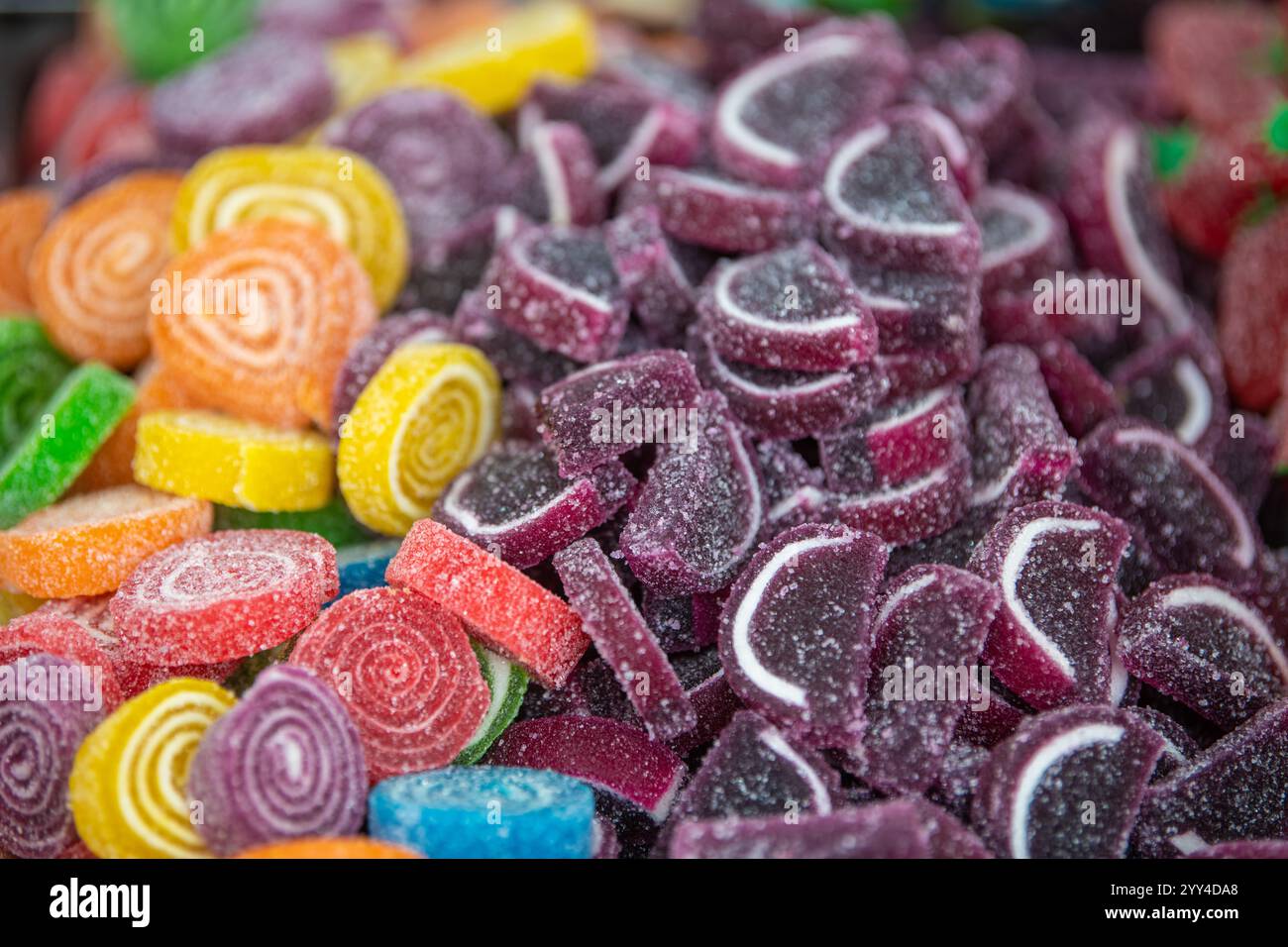 Assorted gummy candies and jellies on street market shop. A lot of ...