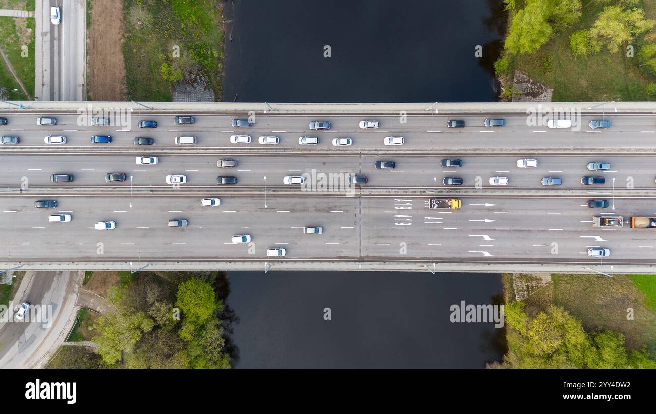 Aerial view of a busy highway bridge over a river with multiple lanes of traffic Stock Photo - Alamy
