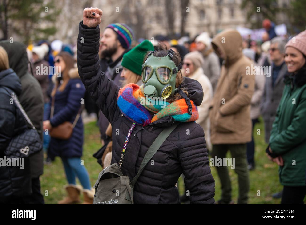 Environmental protests. Woman with gas mask rising hand (fist) on ...