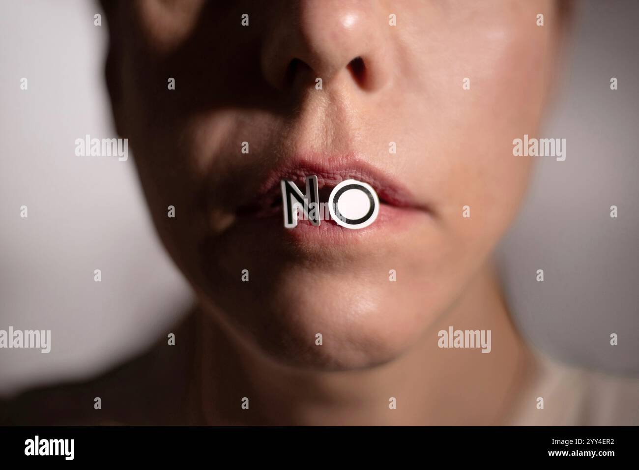 An evocative close-up image of lips with the word No overlaying ...
