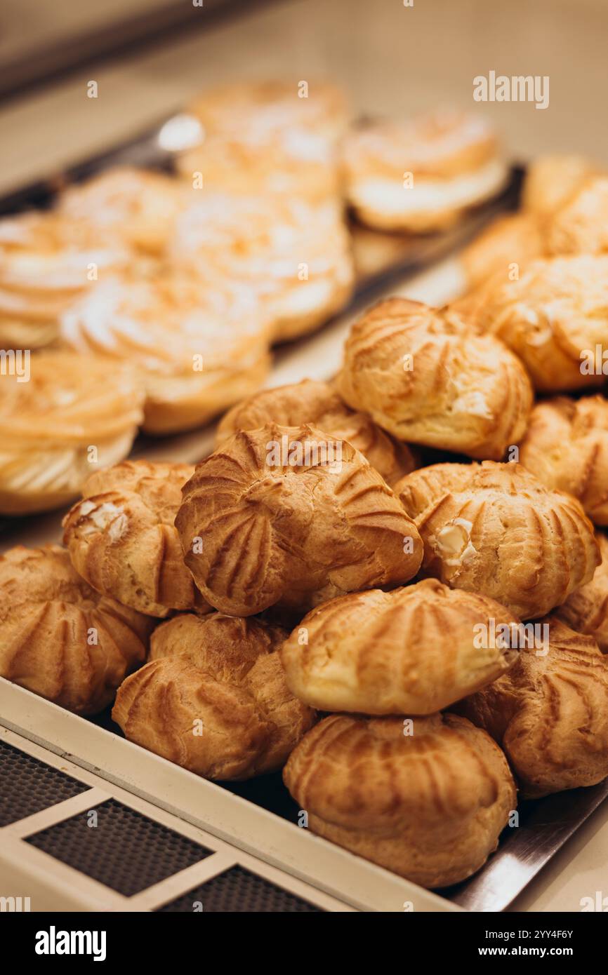 A tempting array of pastries showcased in a bakery shop window ...