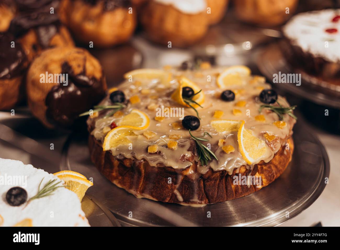 A tempting assortment of pastries and cakes in a bakery window ...