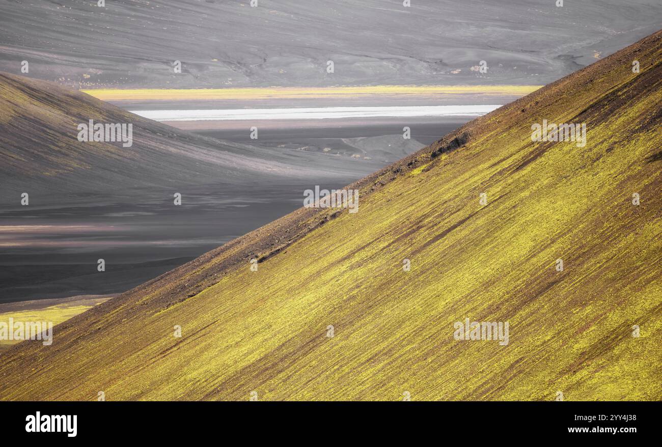 An intriguing view of Iceland's volcanic terrain showcasing lush green ...