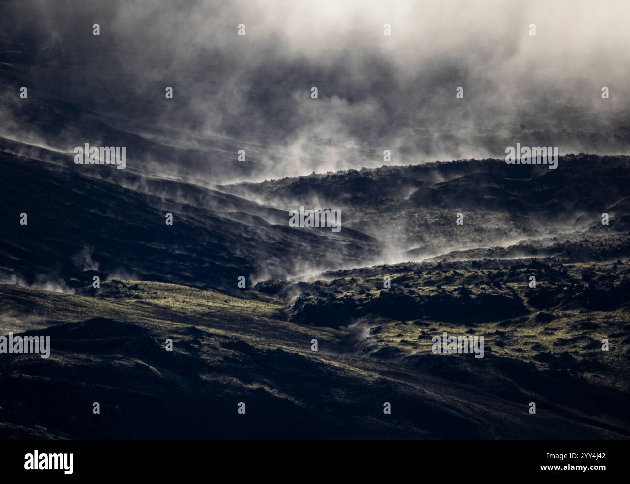 A dramatic Icelandic landscape featuring misty layers and rugged ...