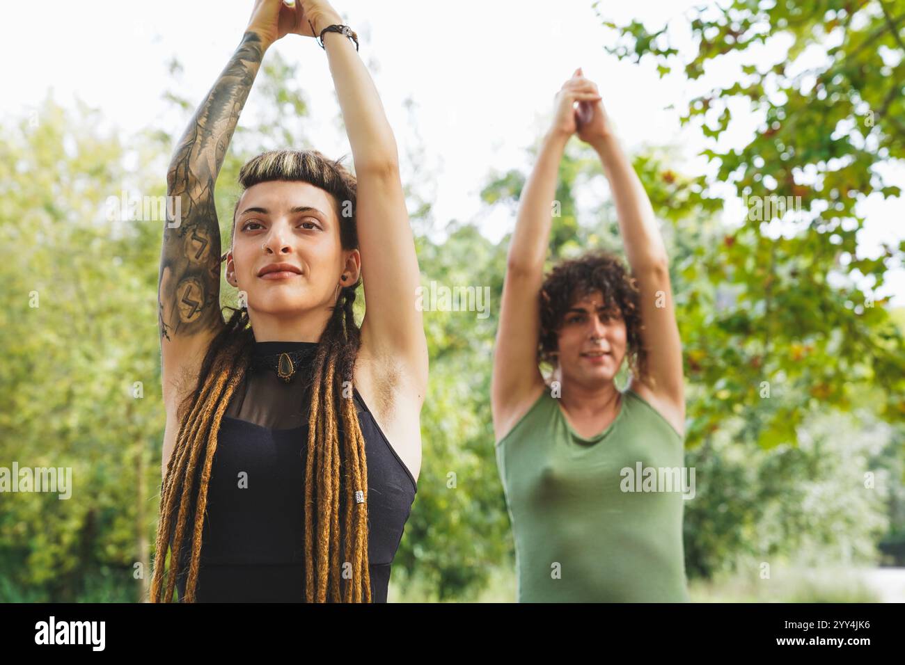 The individual with intricate tattoos and dreadlocks identifies as an ...