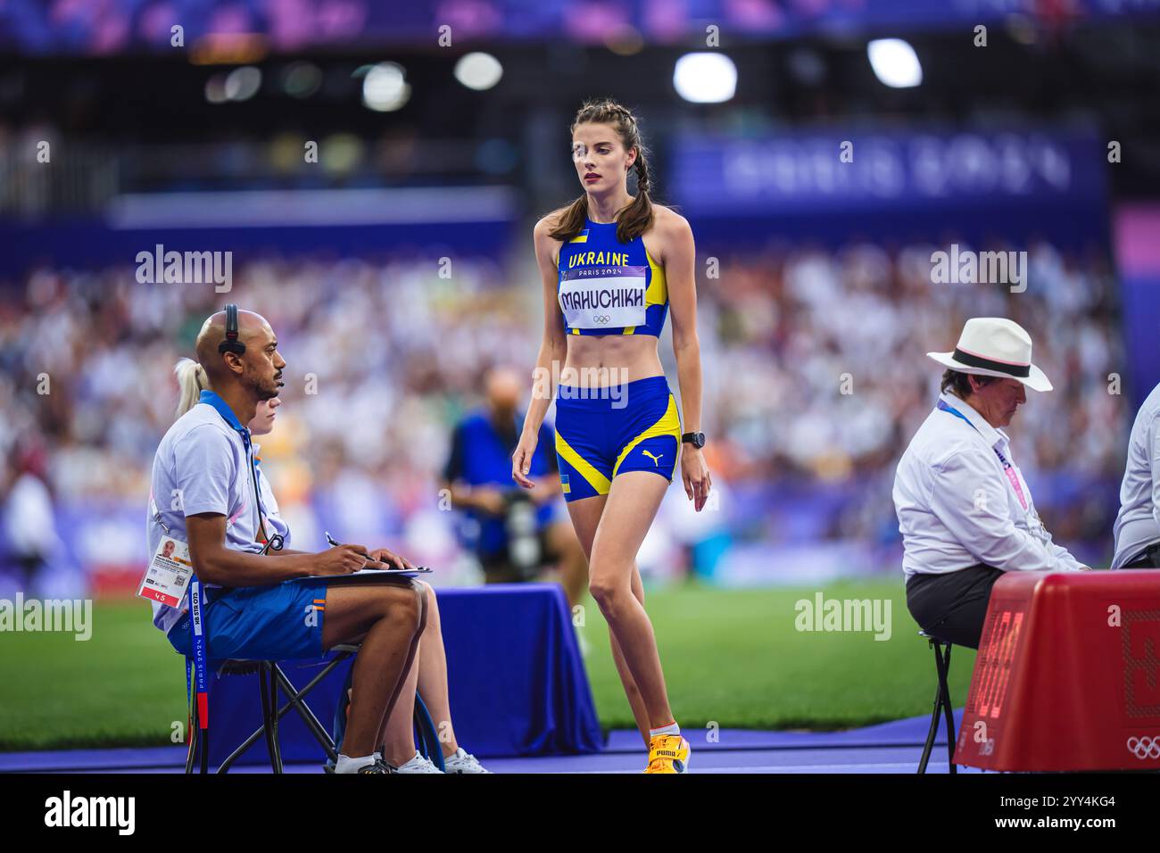 Yaroslava Mahuchikh celebrating her medal with her country's flag at ...