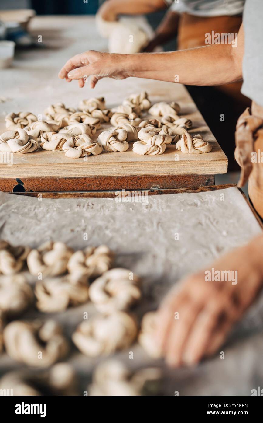 Female senior baker arranging hi-res stock photography and images - Alamy
