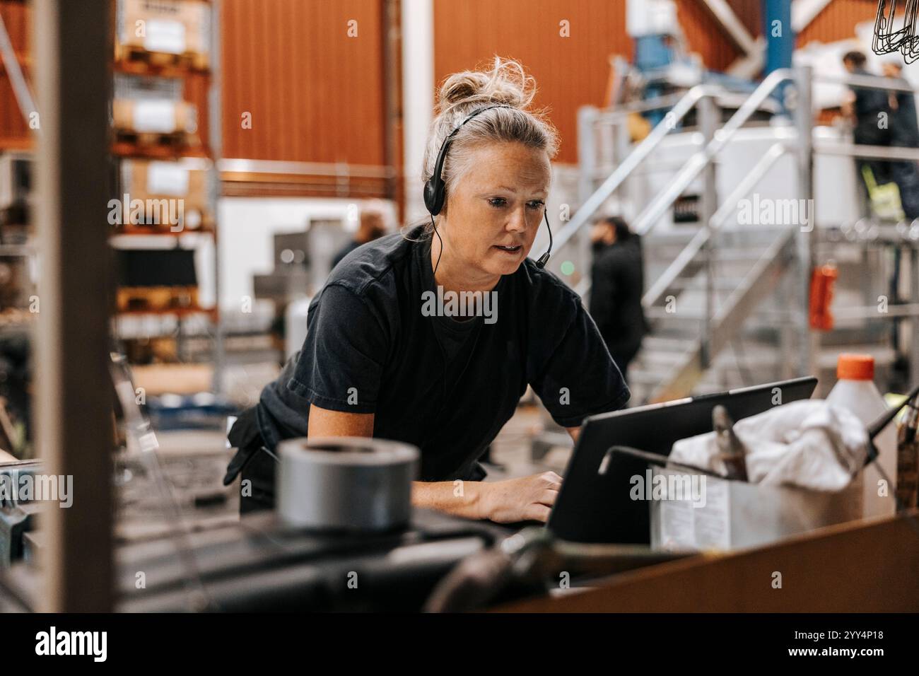 Female warehouse employee wearing headset hi-res stock photography and ...