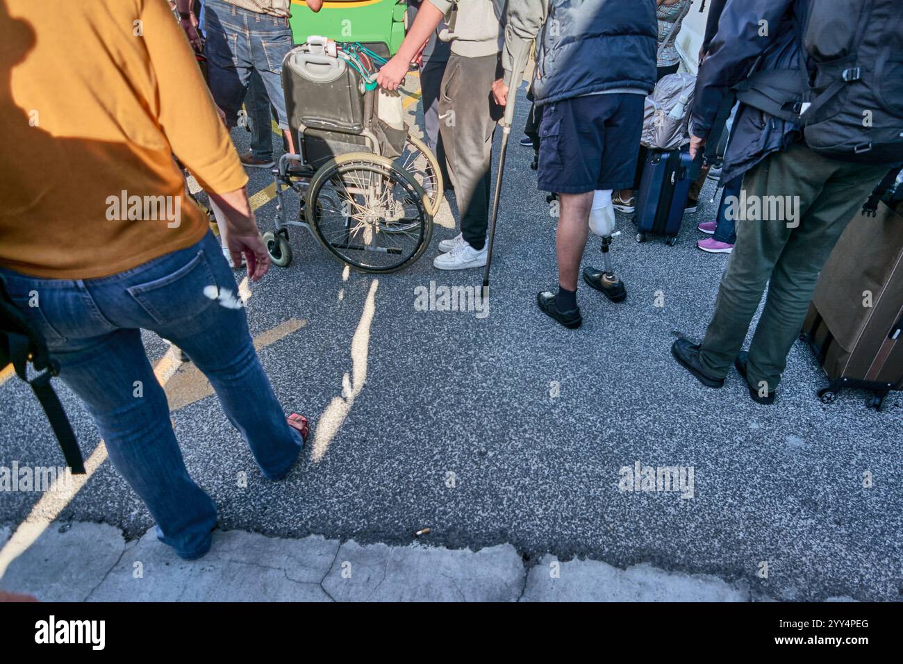 A diverse group of travelers, including people with disabilities ...