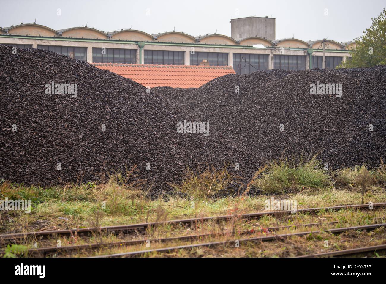 Large pile of black coal. Heaps of coal. Industrial coals. It can be ...