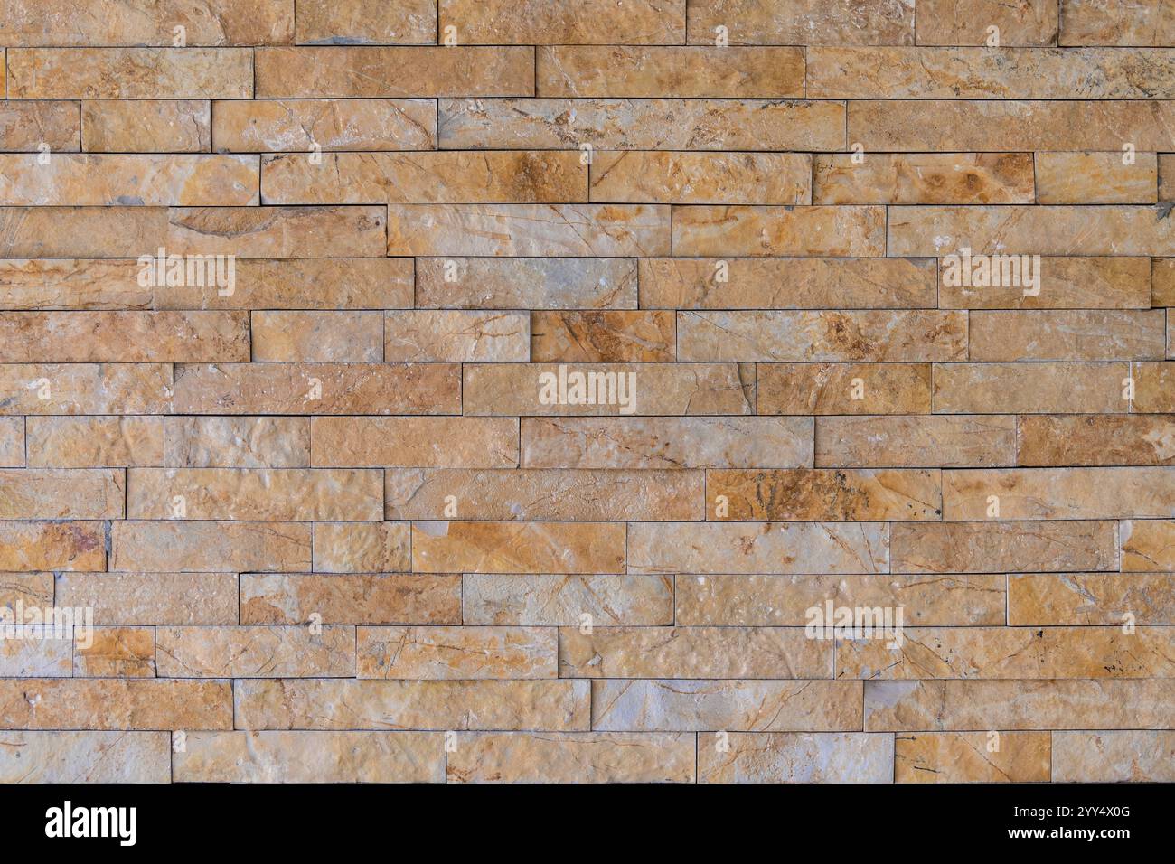 Brick wall facade background. Wall with decorative beige embossed ...