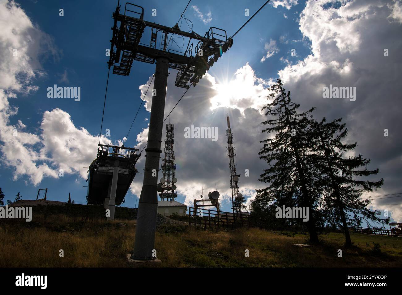 Cable car machinery mechanism mounted high above mountain, farmlands ...