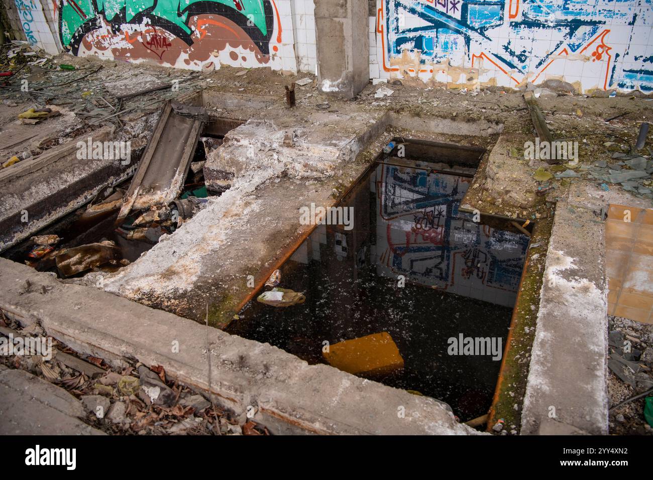 Abandoned industrial building interior covered with dangerous acid and ...