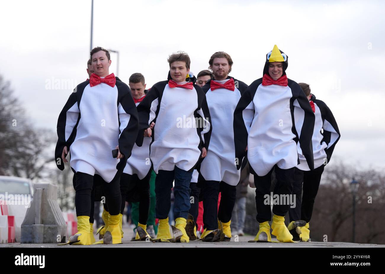 Darts fans in fancy dress arriving for day five of the Paddy Power ...