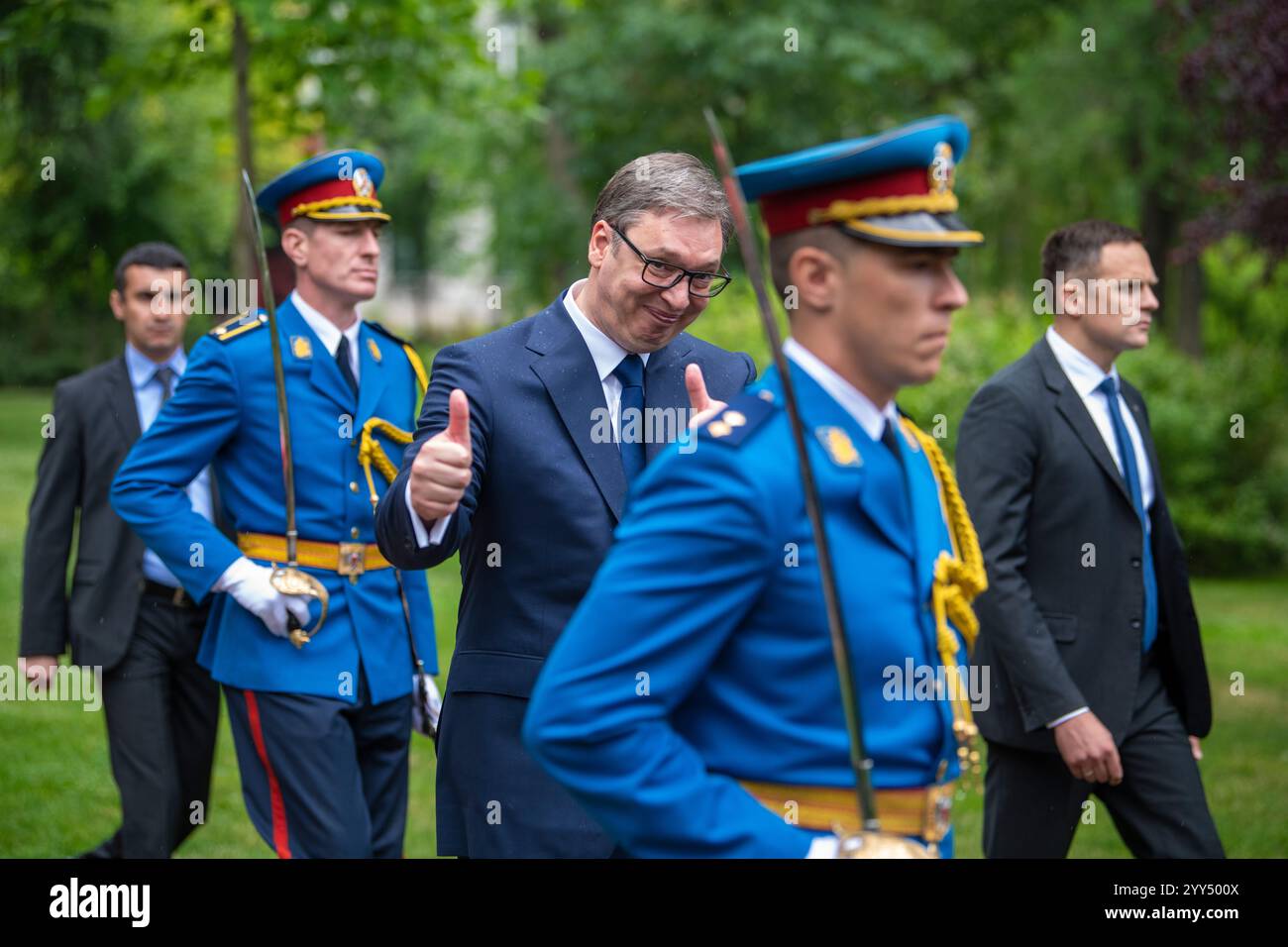 Aleksandar Vucic, the President of Serbia walking on city streets with ...