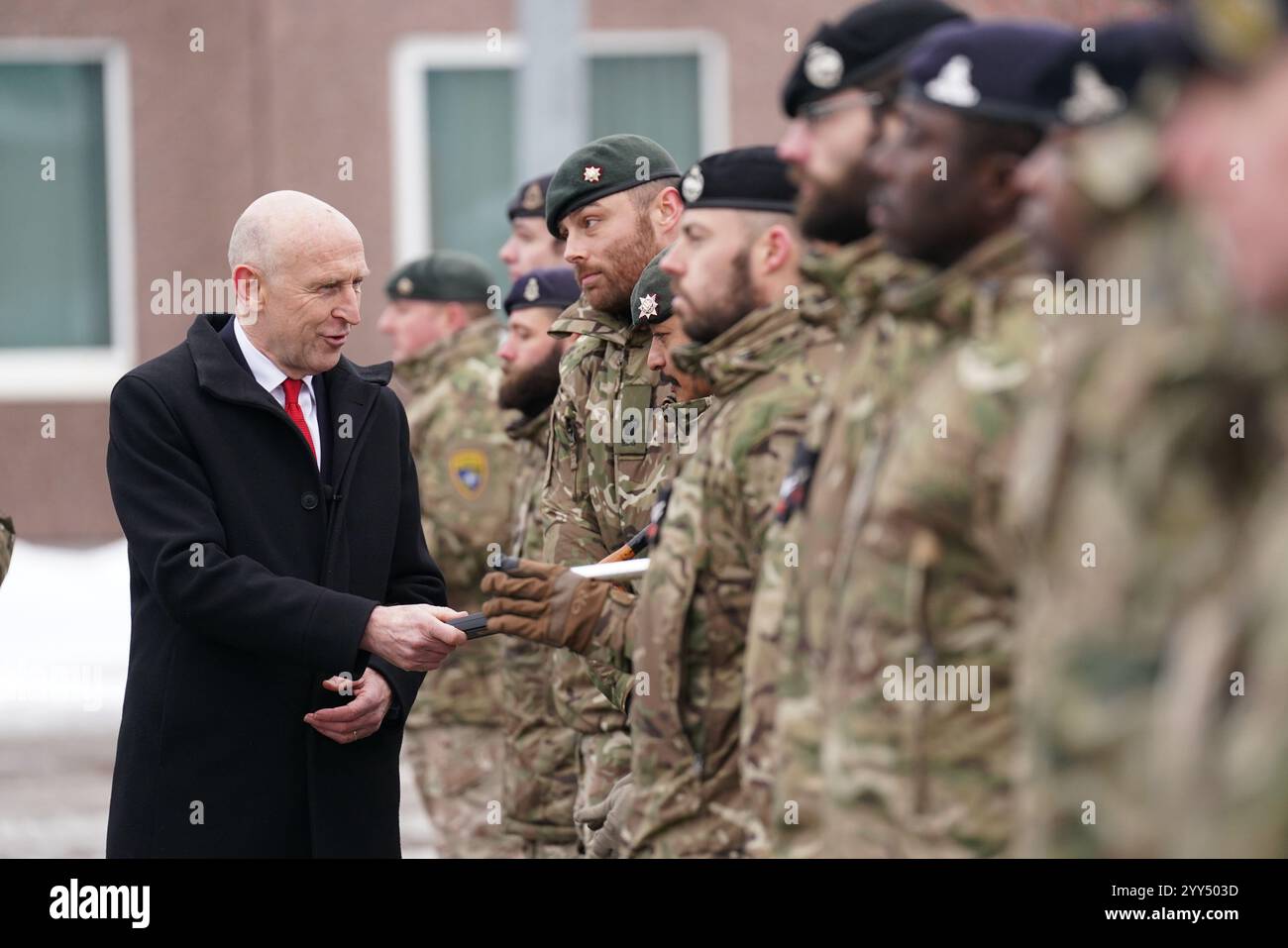 Defence Secretary John Healey giving out Wider Service Medals as he ...