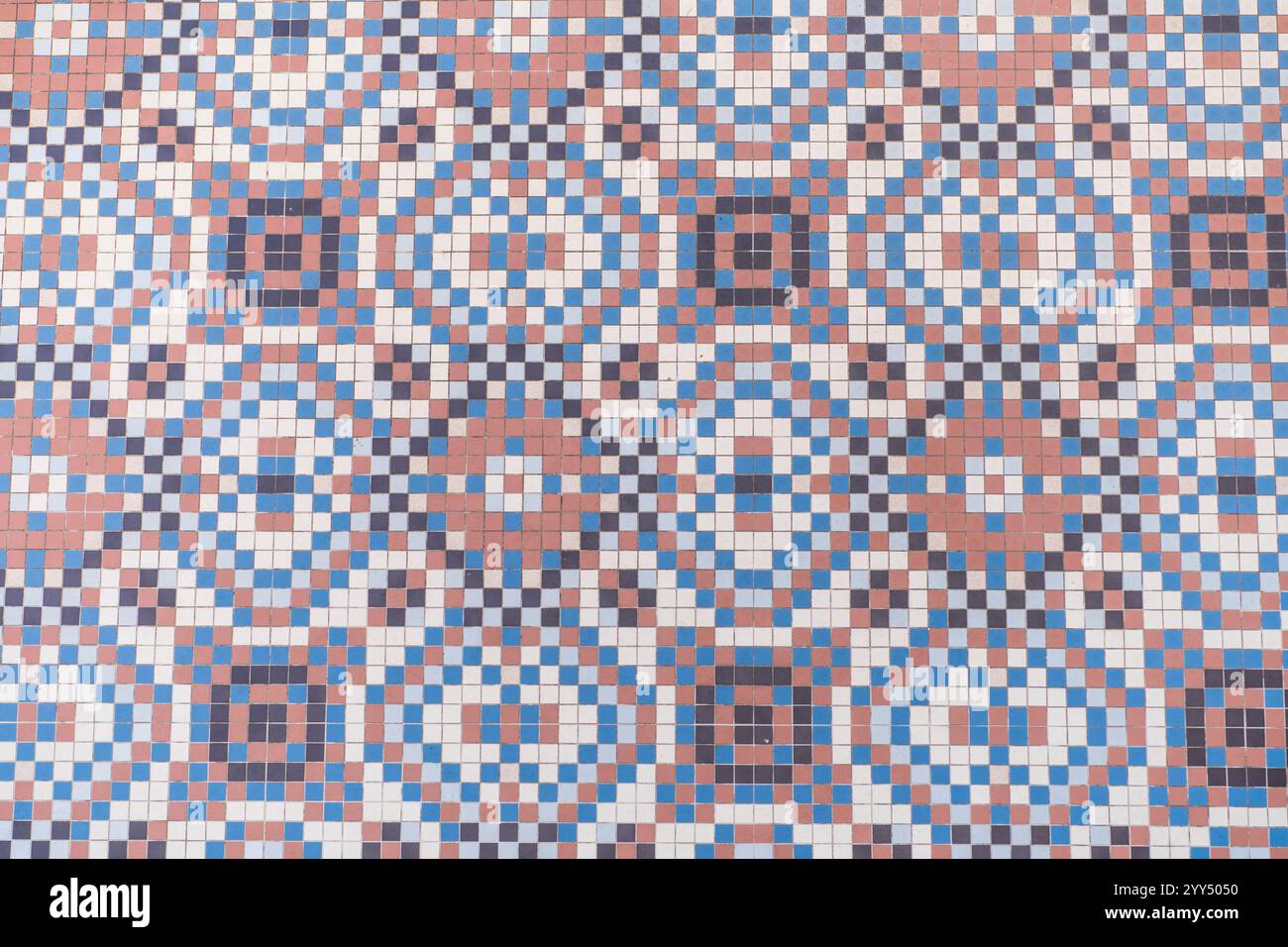 Small checkered square mosaic vintage tile on terrace floor ...