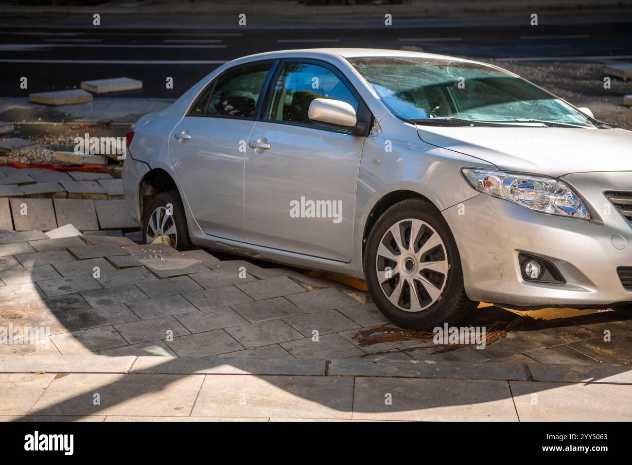 The car fell into a huge sinkhole on broken pavement road surface on ...