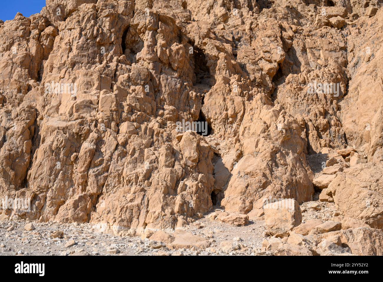 Caves in the Marl cliff at Qumran archeological site on the shore of ...