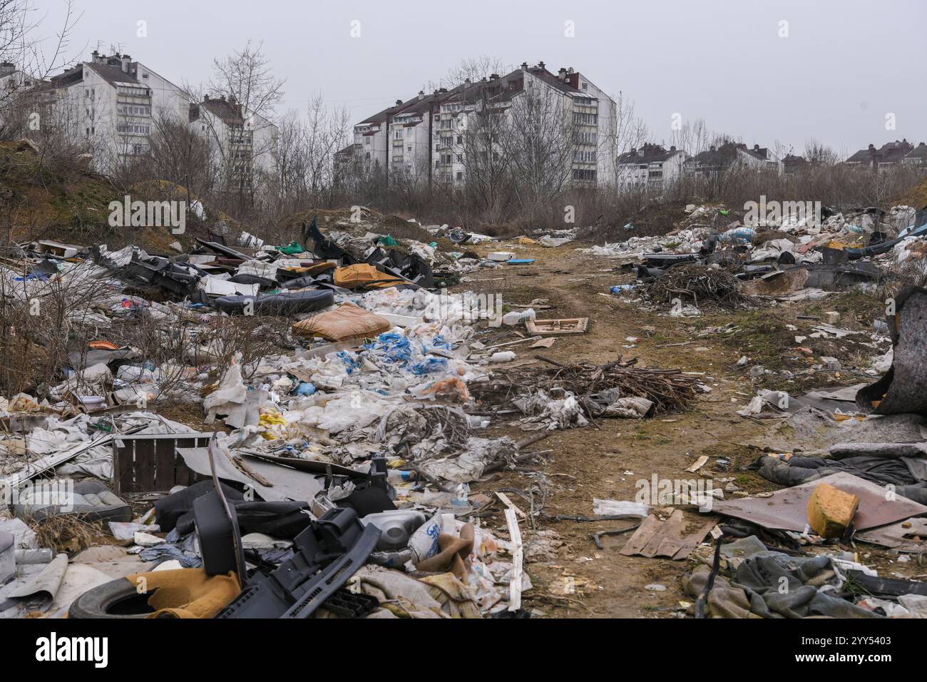 Illegal Landfill in city residential area with Buildings in background ...