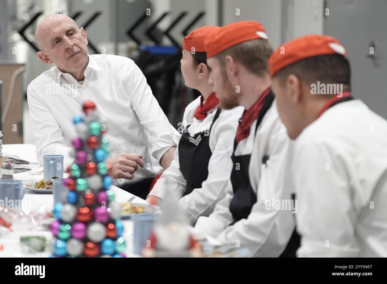 Defence Secretary John Healey talking to cooks and kitchen staff during ...