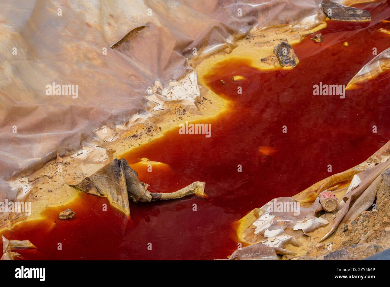 Red polluted toxic water in copper mine. Mining of ores of various ...