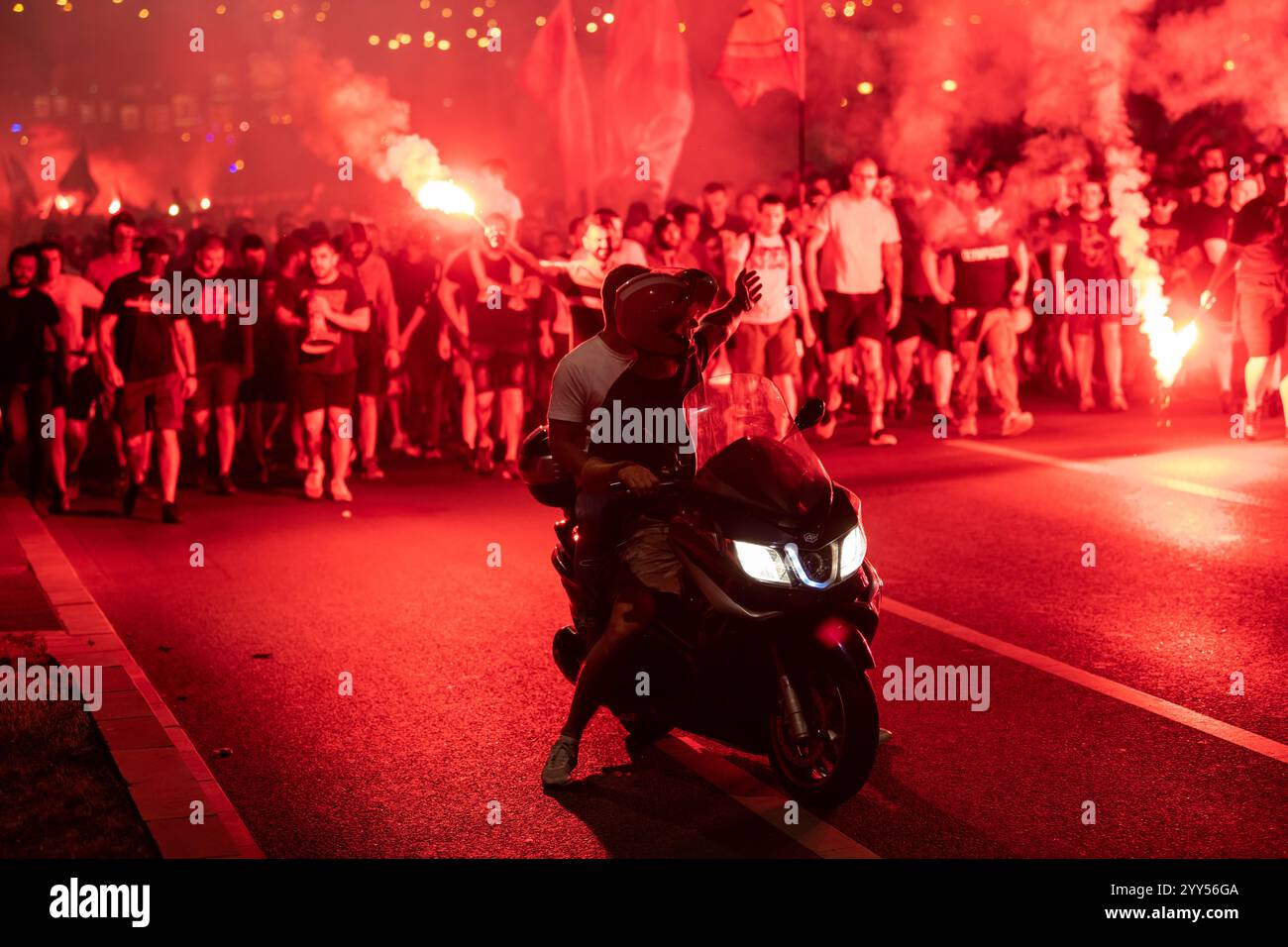 Red Star Football fans with torches and flags marching on streets and ...