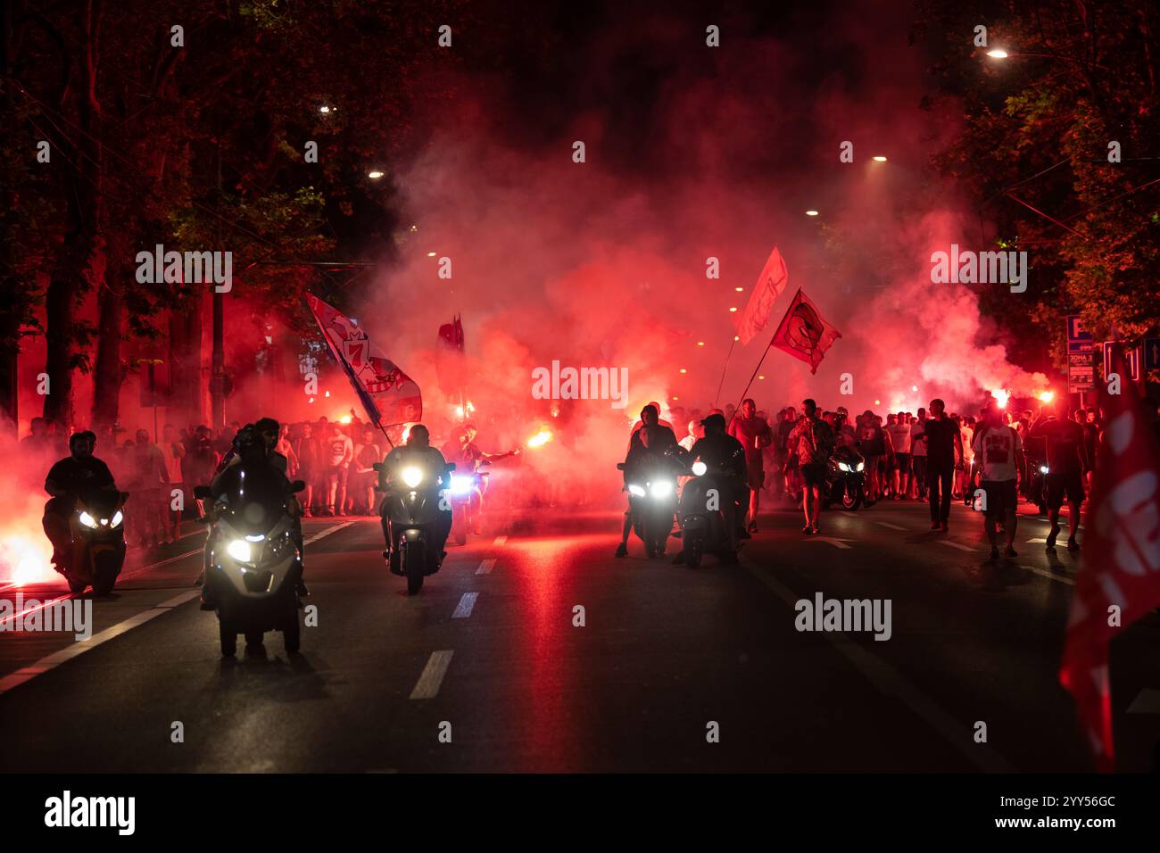 Red Star Football fans with torches and flags marching on streets and ...