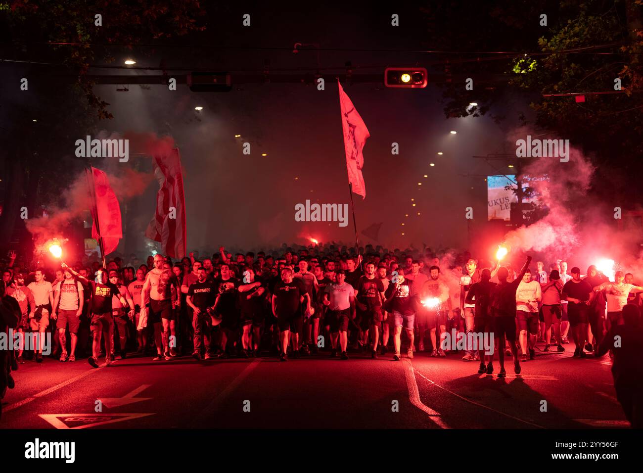 Red Star Football fans with torches and flags marching on streets and ...